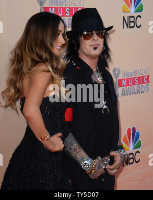 Musician Niki Sixx, right, and Courtney Bingham attend the iHeartRadio ...