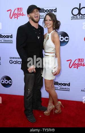 Brantley Gilbert, left, and Amber Cochran Gilbert arrive at the 60th ...