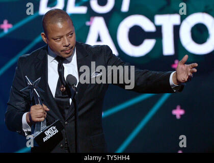 Terrence Howard accepts the award for best actor at the BET Awards at ...