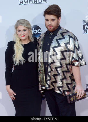 Who Is Fancy, left, and Meghan Trainor arrive at the American Music ...