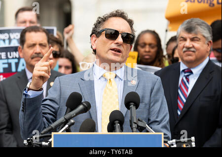 U.S. Representative Andy Levin (D-MI) speaking at a rally against the ...