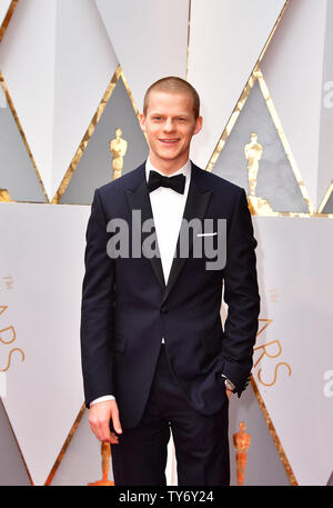 Actor Lucas Hedges arrives with an assortment of Oscar-themed food on ...