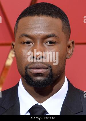 Actor Trevante Rhodes arrives on the red carpet for the 89th annual ...
