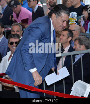 Haim Saban, creator of the "Power Rangers," poses at a ceremony ...