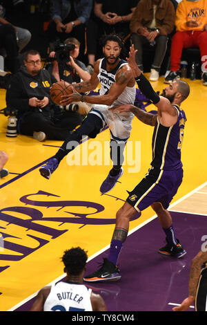 Minnesota Timberwolves guard Derrick Rose, right, drives to the basket ...