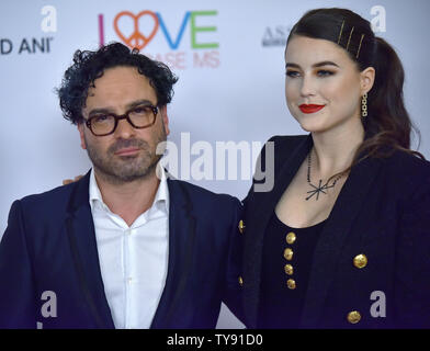 Johnny Galecki (L) and his girlfriend Alaina Meyer arrive on the orange ...