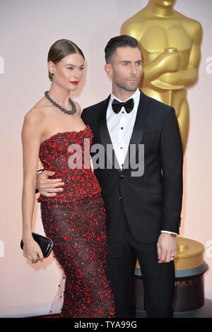 Adam Levine of Maroon 5 and his wife Behati Prinsloo arrive on the red ...