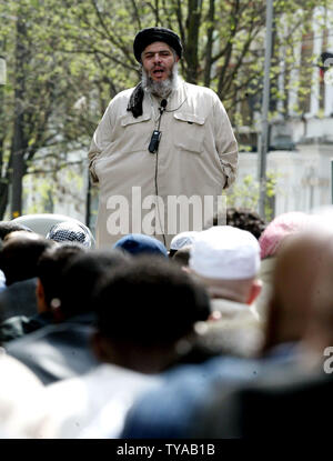 Muslim leader Sheikh Abu Hamza speaks to members of the Muslim group Al ...
