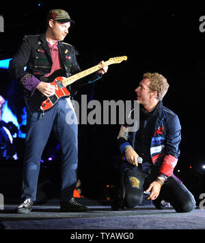 Singer Chris Martin (R) and guitarist Jonny Buckland of the band ...