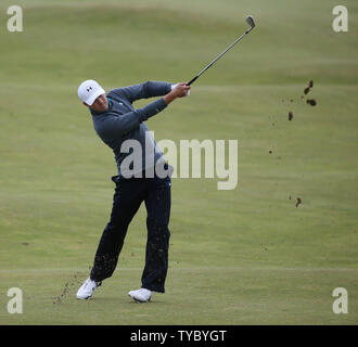 American Jordan Spieth plays a shot from the fairway on the 18th hole ...