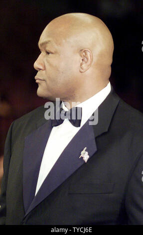 Former heavyweight champion George Foreman, left, and Charlie Hostetter ...