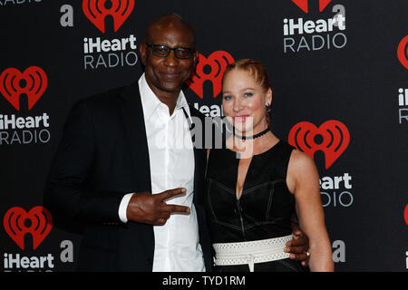 NFL legend Eric Dickerson and his wife Penny Sutton arrive for the ...