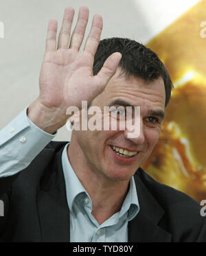 Actor Jerome Bertin gestures during a photocall for the television show ...
