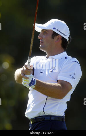 Francesco Molinari, of Italy, watches his tee shot on the second hole ...