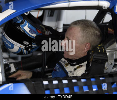 NASCAR NEXTEL Cup driver Mark Martin relaxes in the garage following ...