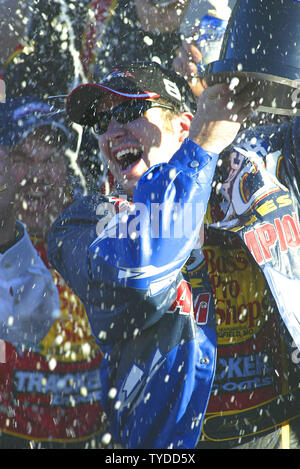 Martin Truex Jr., celebrates winning the NASCAR Cup series auto race in ...