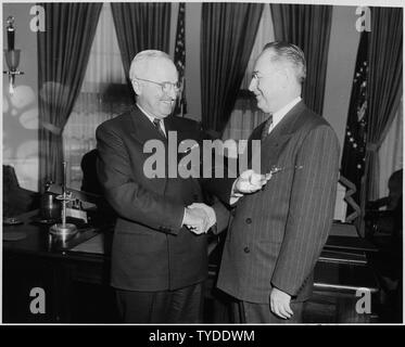 Photograph of President Truman presenting First Lt. Henry Commiskey of ...