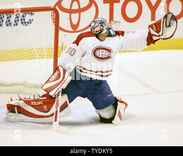 Montreal Canadiens goalie David Aebischer makes a save against the ...