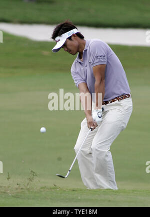 Ryuji Imada chips onto the 18th green during round one of the World ...