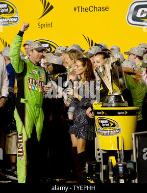Kyle Busch holds the NASCAR Nationwide series O'Reilly Challenge trophy after winning the race ...