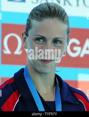 American diver Laura Wilkinson, of Spring, Tex., brandishes her gold ...