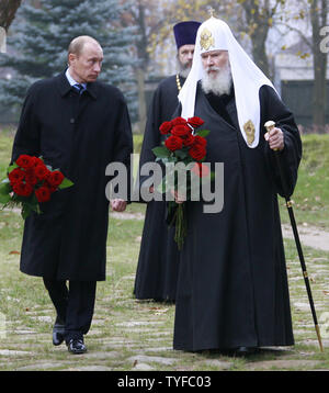 Russian Orthodox priests walk in the courtyard of the 17th century ...