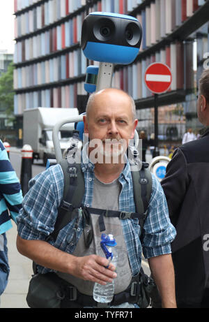 google street view walker trekker Stock Photo - Alamy