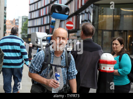 google street view walker trekker Stock Photo - Alamy