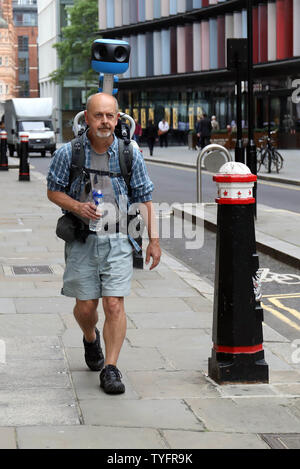 google street view walker trekker Stock Photo - Alamy