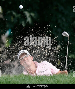 Fredrik Jacobson hits out of the bunker on his 18th hole of the day in ...