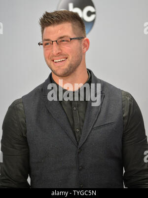 Tim Tebow arrives at the 48th annual CMA Awards at the Bridgestone ...