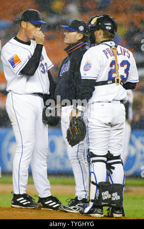 The Atlanta Braves pitching coach Rick Kranitz lights a cigar in ...