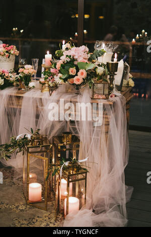wooden lantern decorated with flowers as a wedding decor Stock Photo ...