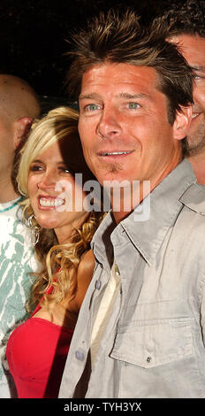 The cast of Extreme Makeover: Home Edition is shown on the field before ...