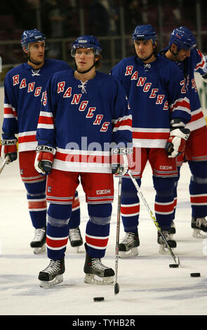 New York Rangers (25) Petr Prucha and (14) Jason Ward hit the ground ...
