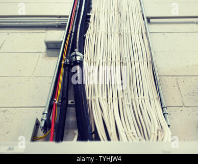 group of electricity cables at wall Stock Photo - Alamy