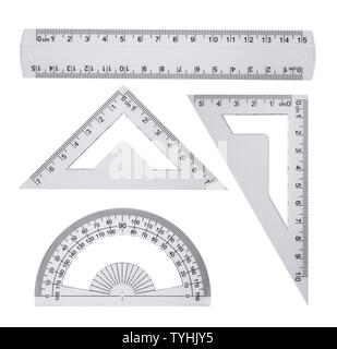 Rulers, triangle and protractor on white background, collage ...