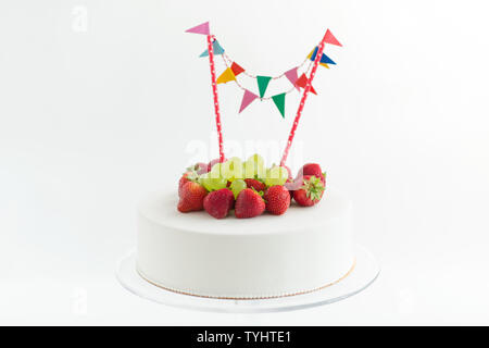close up of birthday cake with garland on stand Stock Photo - Alamy