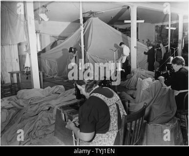 Rigging and inspecting of 8-man pyramidal tents which are being ...