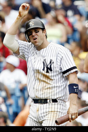 New York Yankees Doug Mientkiewicz watches the ball fly after hitting a ...