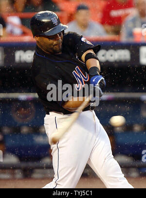 New York Mets' Ramon Castro swings for a three-run home run against the ...