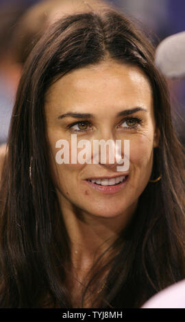 Demi Moore smiles on the field before the New York Giants play the ...