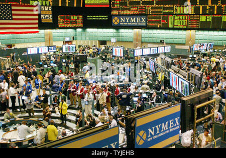 Traders conduct business in the oil options pit at the NYMEX after ...