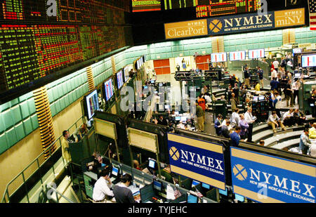 Traders conduct business in the oil options pit at the NYMEX after ...