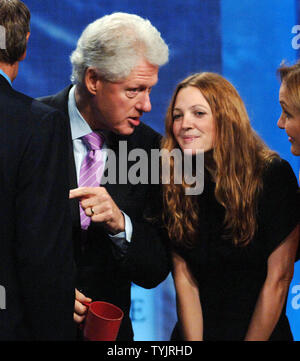 Actress Drew Barrymore chats with former President Bill Clinton at the ...
