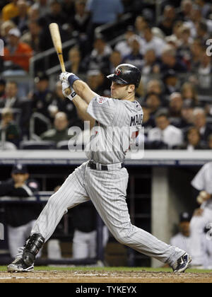 Minnesota Twins' Joe Mauer hits an RBI-single as New York Yankees ...