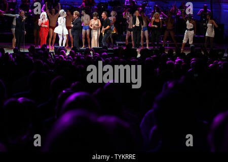 Lady Gaga, Elton John and Bruce Springsteen perform at the Rainforest ...