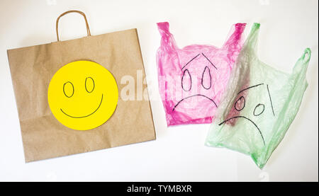 Plastic bags with sad emotions against white background. Ecology ...