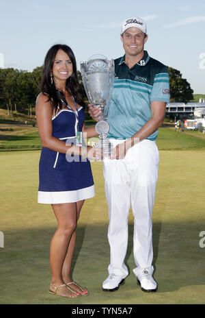Nick Watney and wife Amber hold up the Championship Trophy after the ...