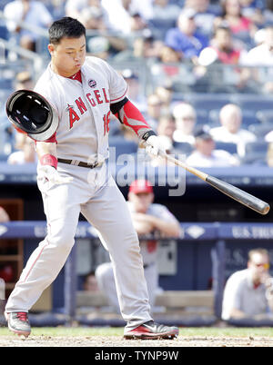 Los Angeles Angels' Hank Conger follows through on an RBI single during ...